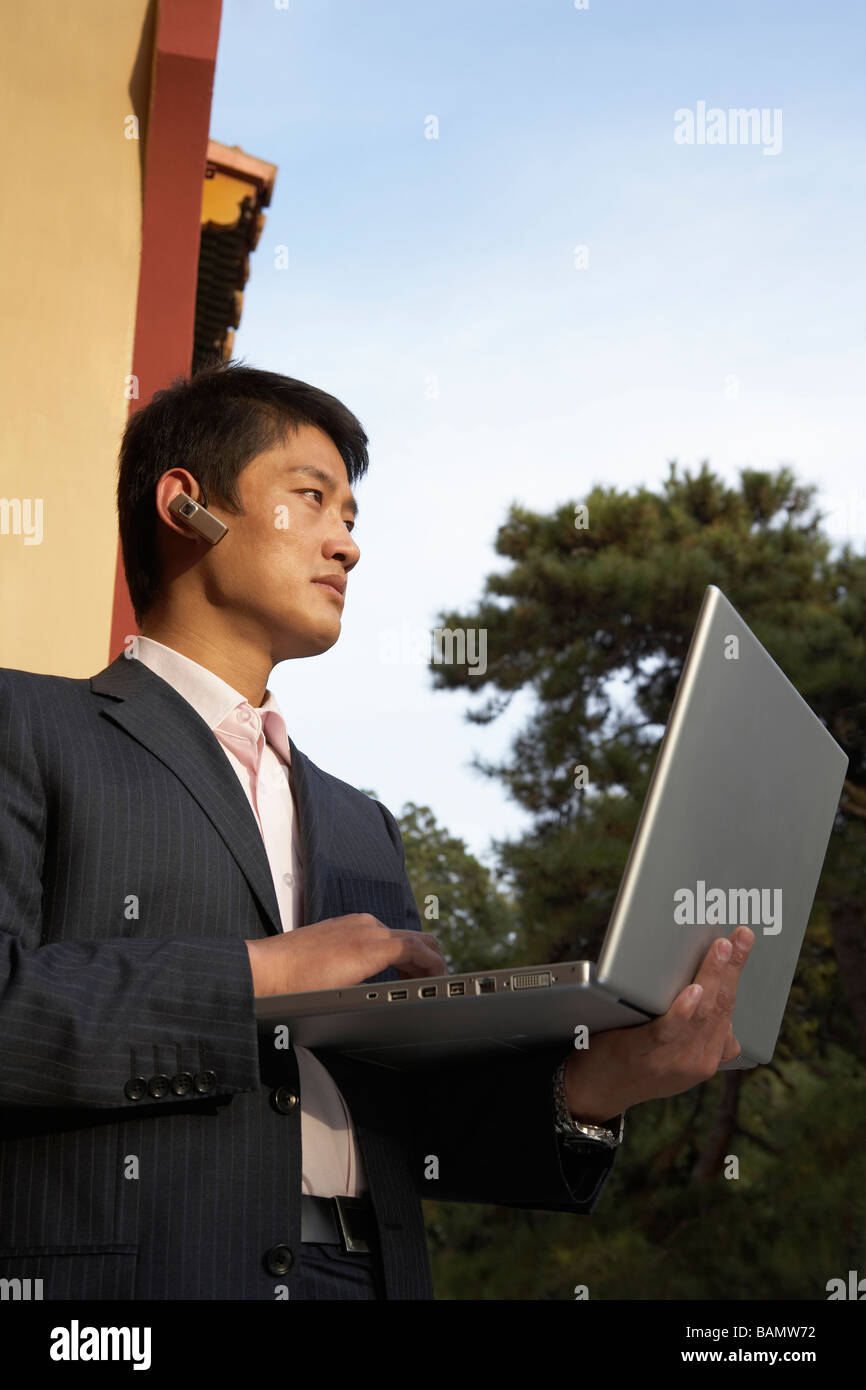 Businessman Holding Laptop Stock Photo - Alamy