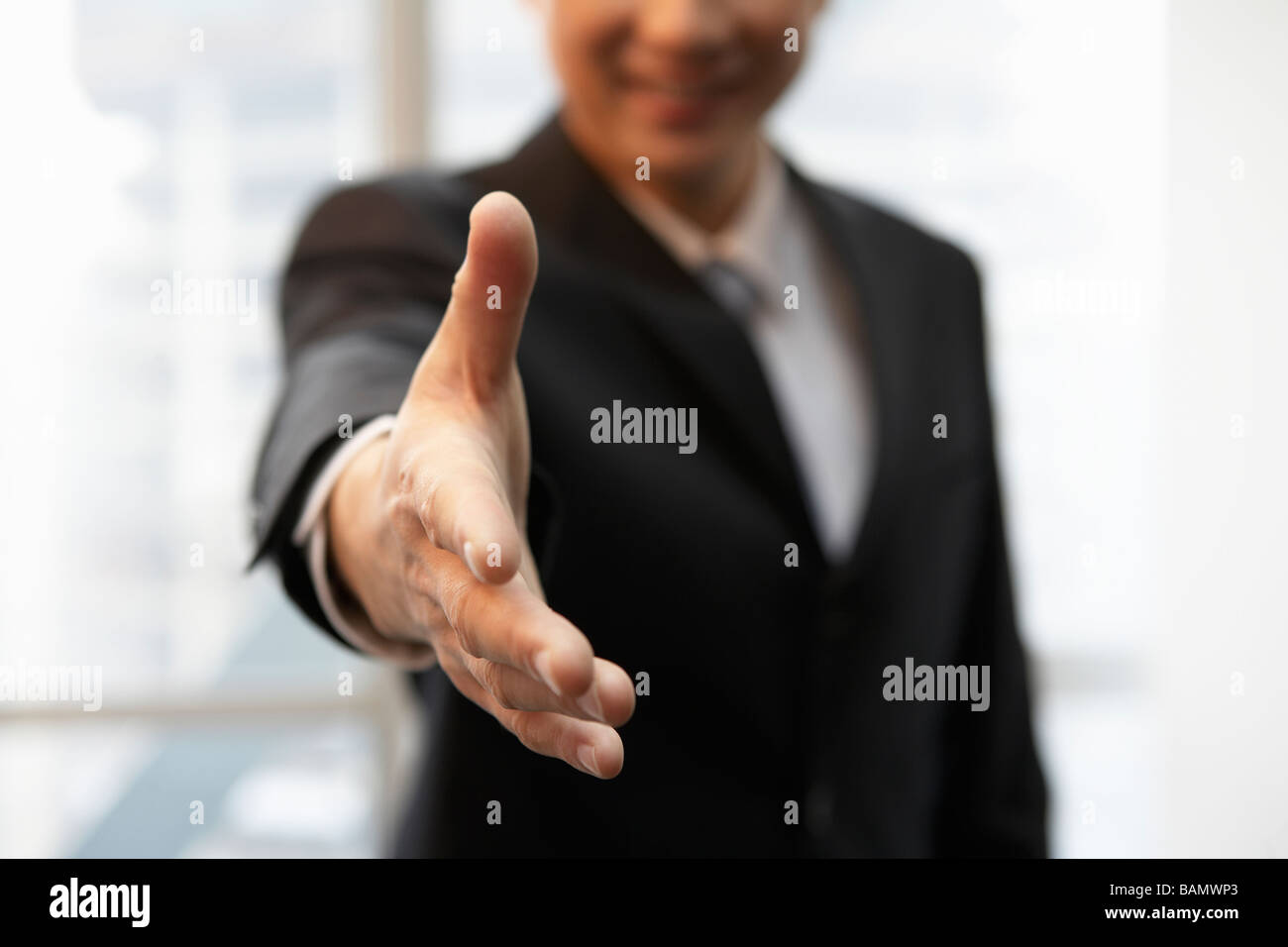 Business partner reaching out handshake hi-res stock photography and ...