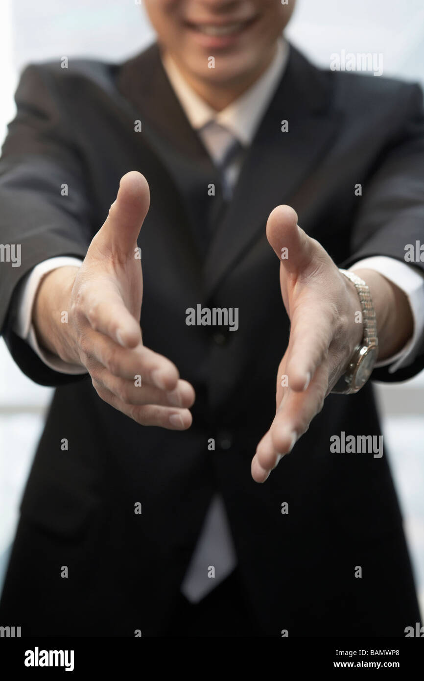 Business partner reaching out handshake hi-res stock photography and ...