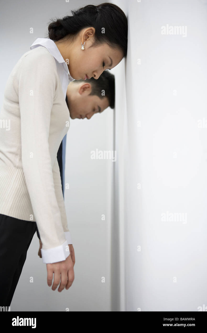 Business People Resting Faces Against Wall Stock Photo - Alamy