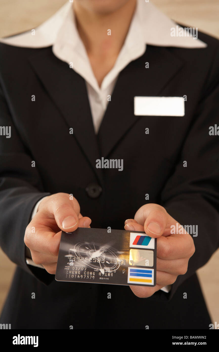 Hotel Employee Holding Credit Card Stock Photo - Alamy