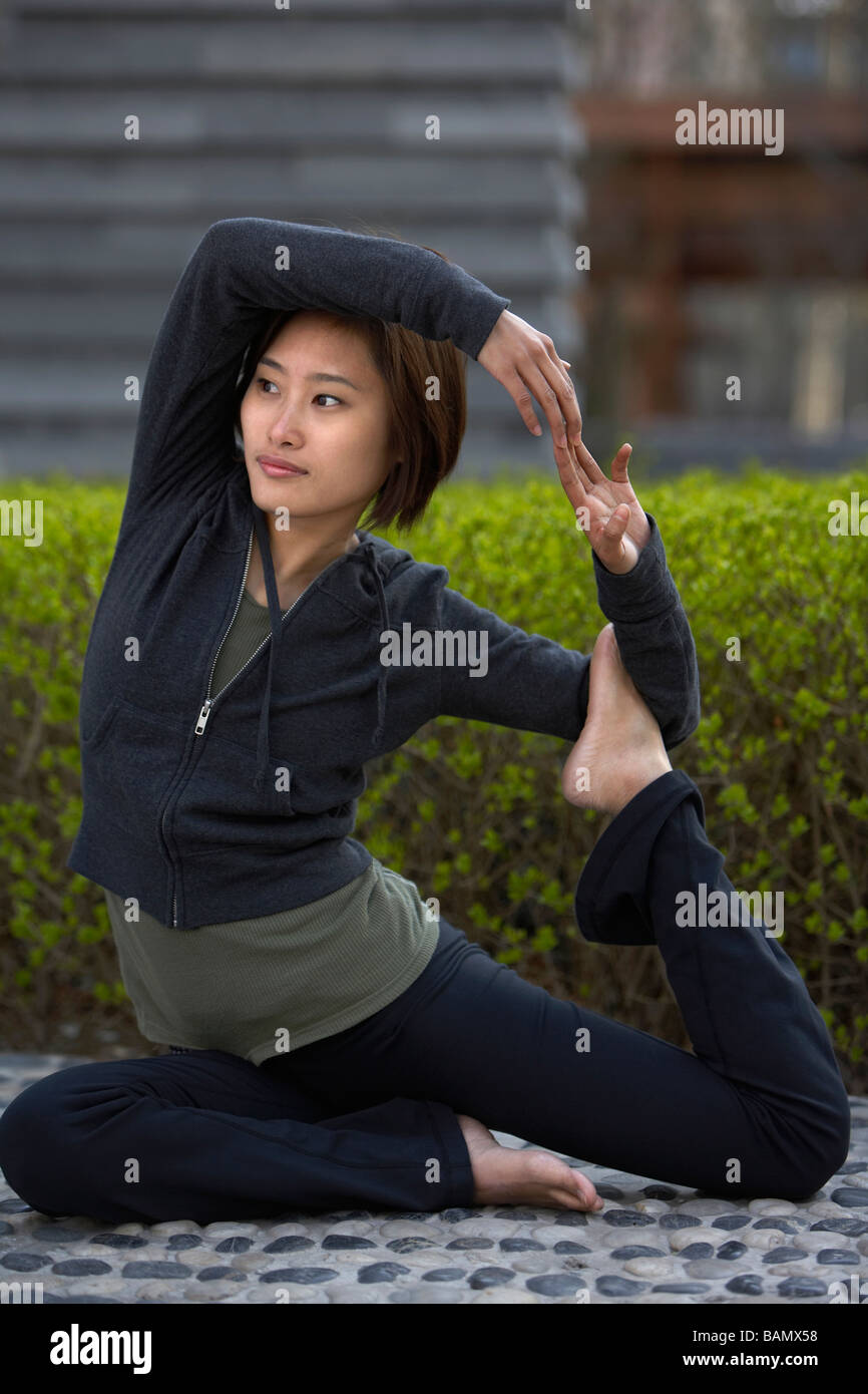 Fit young woman stretches arms hi-res stock photography and images - Alamy