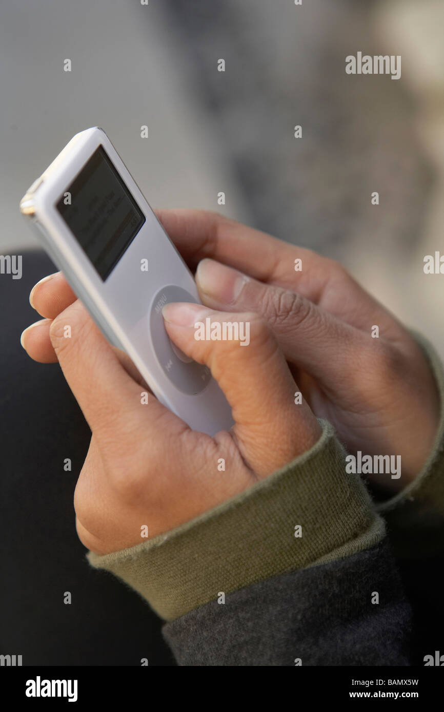 Young Woman Using MP3 Player Stock Photo - Alamy