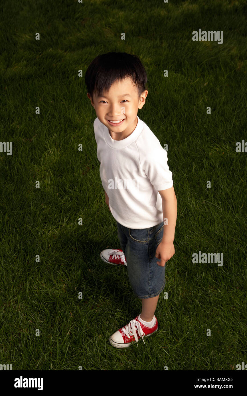 High Angle View Of Boy Standing On Lawn Stock Photo - Alamy