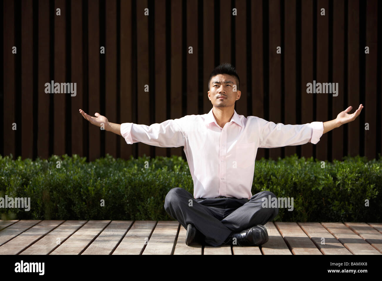 Seated young man resting arm hi-res stock photography and images - Alamy