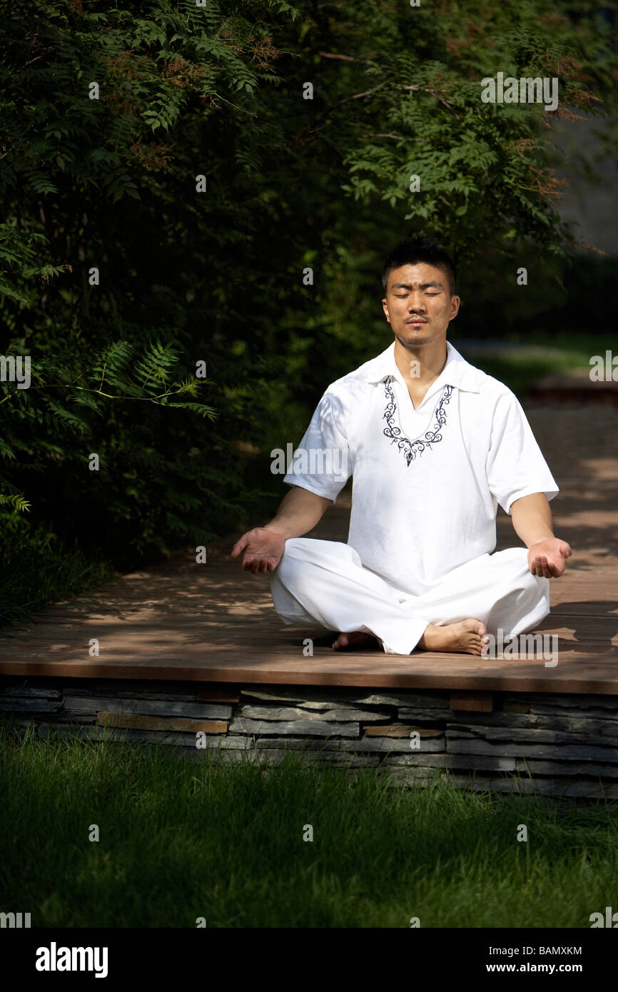 Man Meditating Outdoors Stock Photo - Alamy