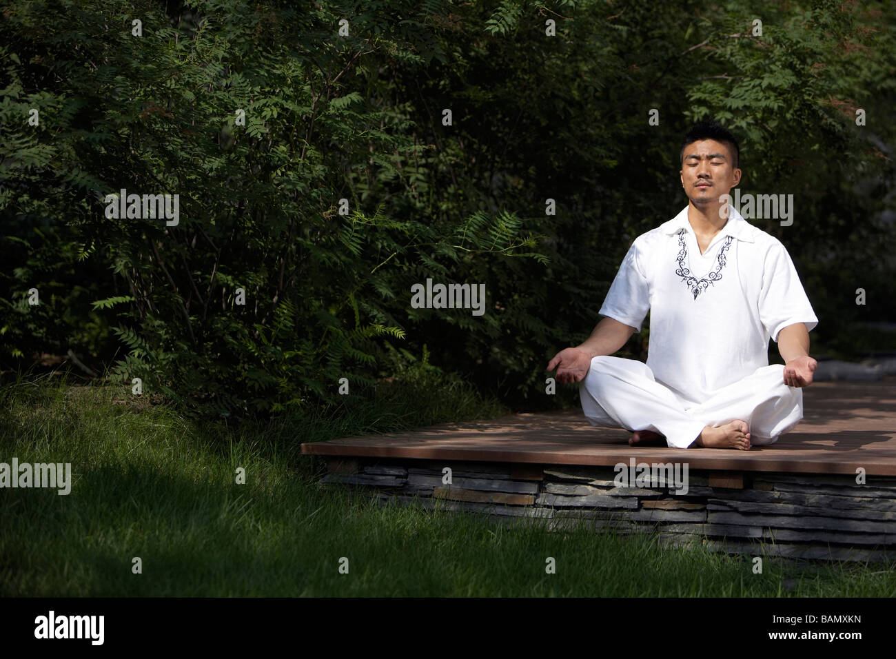 Man Meditating Outdoors Stock Photo - Alamy