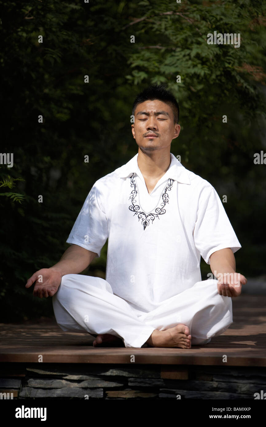 Man Meditating Outdoors Stock Photo - Alamy