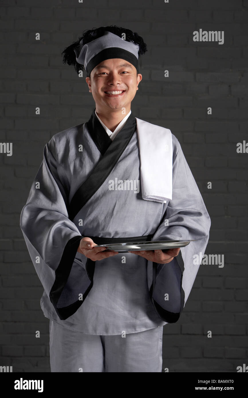 Tradtional Chinese waiter Stock Photo - Alamy
