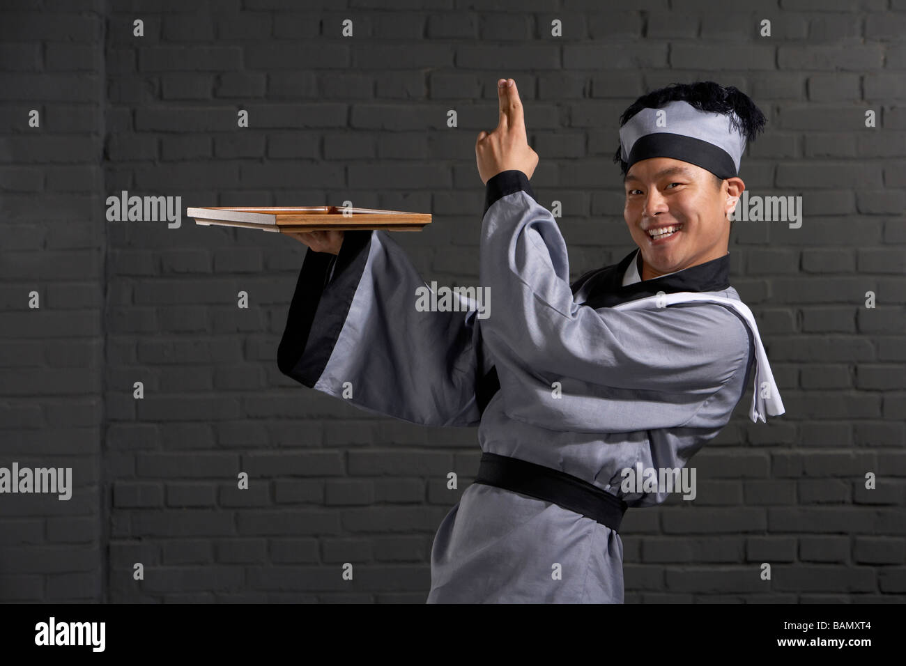 Tradtional Chinese waiter Stock Photo - Alamy
