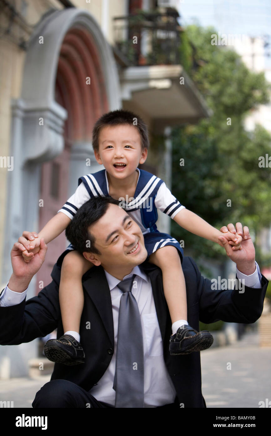 A father picks his son up from school Stock Photo - Alamy