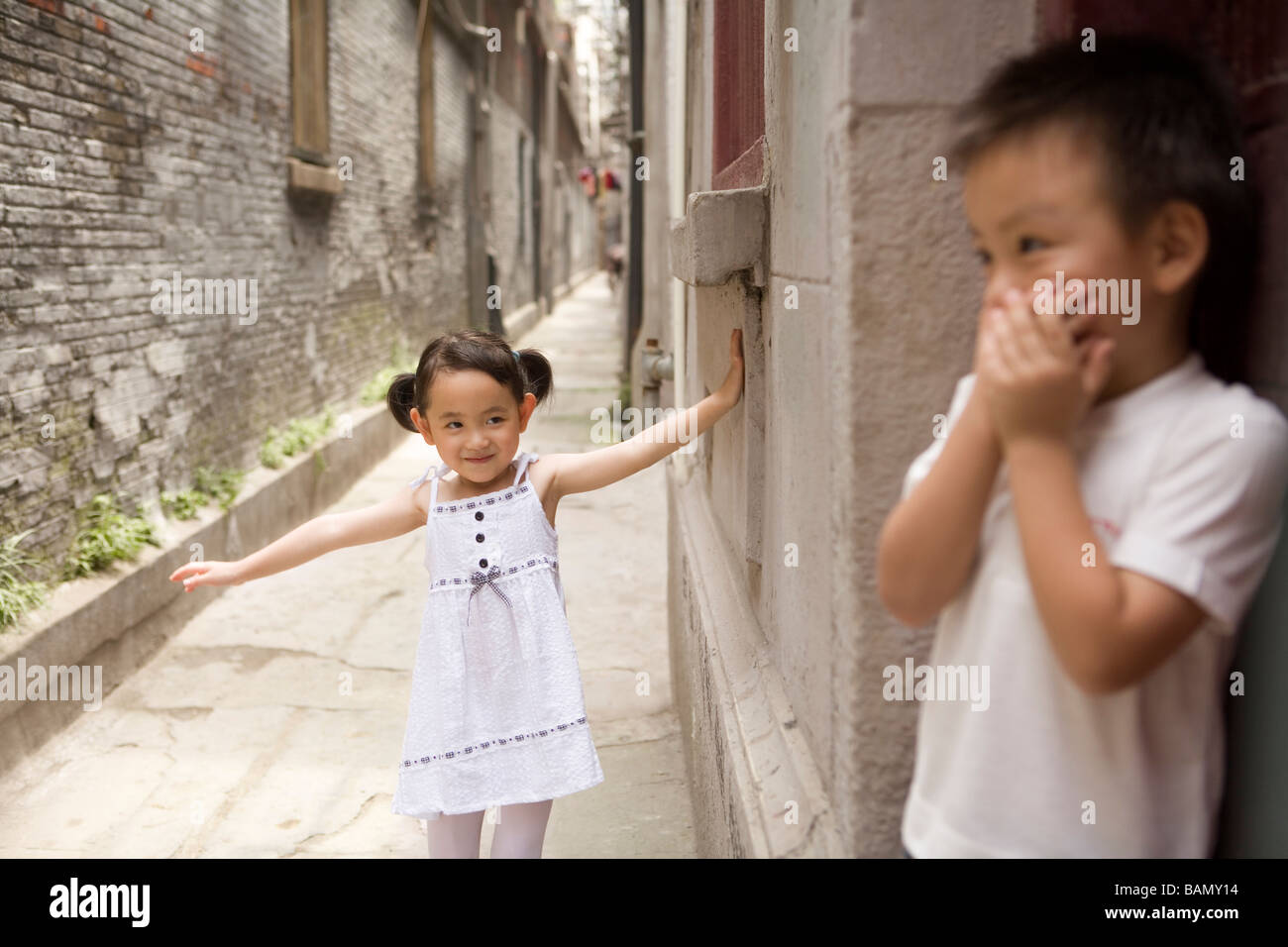 Children playing hide and seek Stock Photo - Alamy