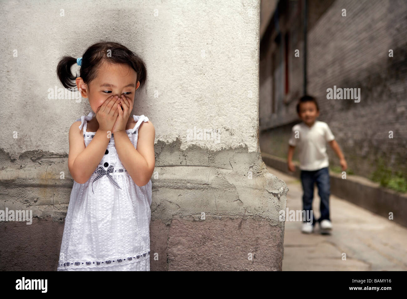 Children playing hide and seek Stock Photo - Alamy