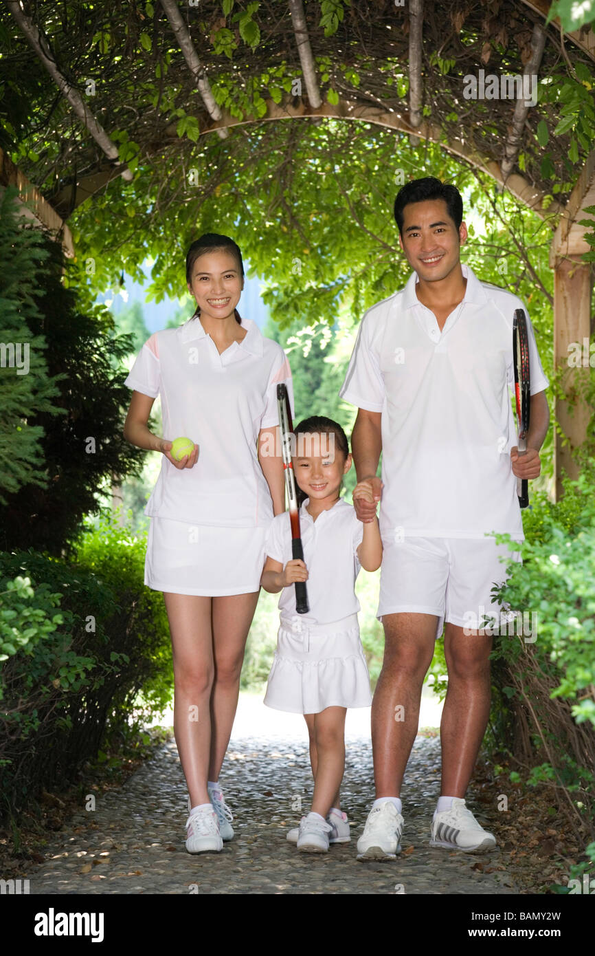 A one child family goes to play tennis Stock Photo - Alamy