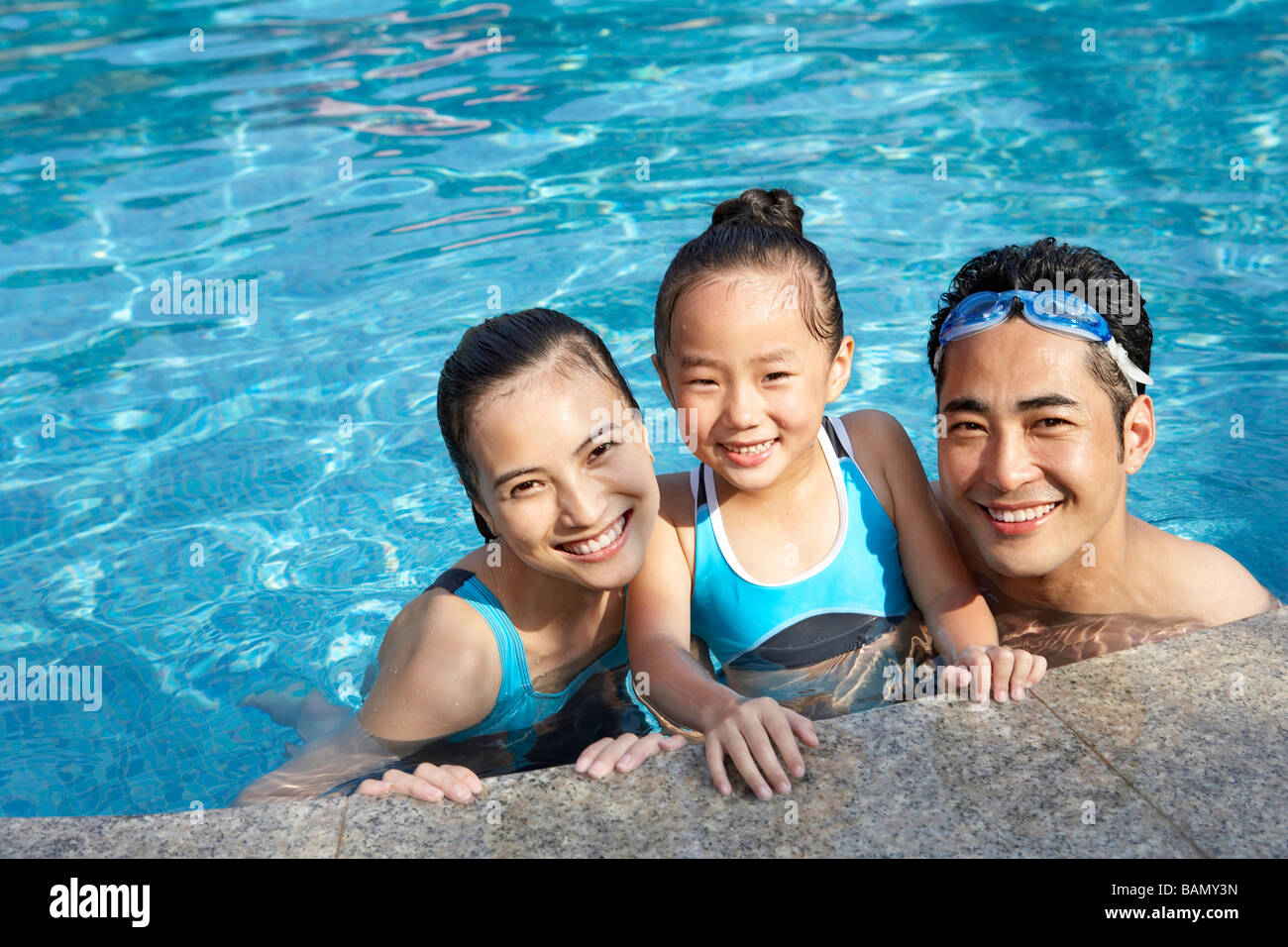 A one child family at the pool Stock Photo - Alamy
