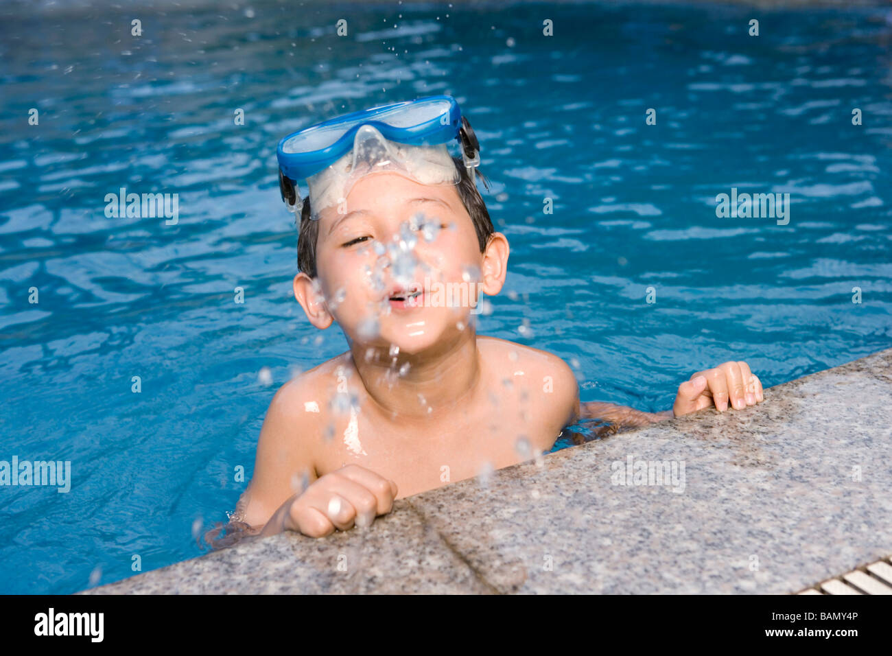 Young boy at the pool Stock Photo - Alamy