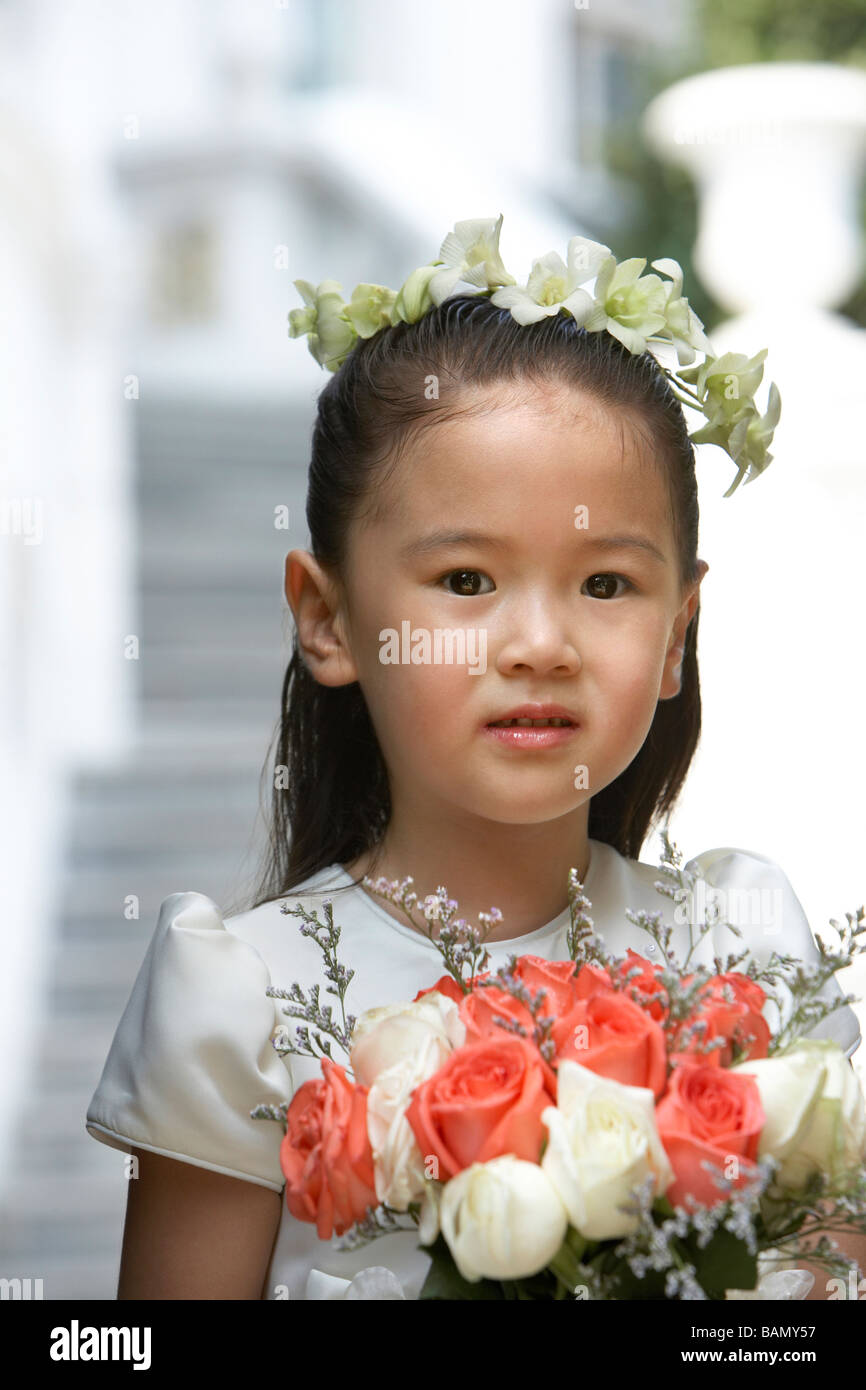 A young flower girl for a wedding Stock Photo - Alamy