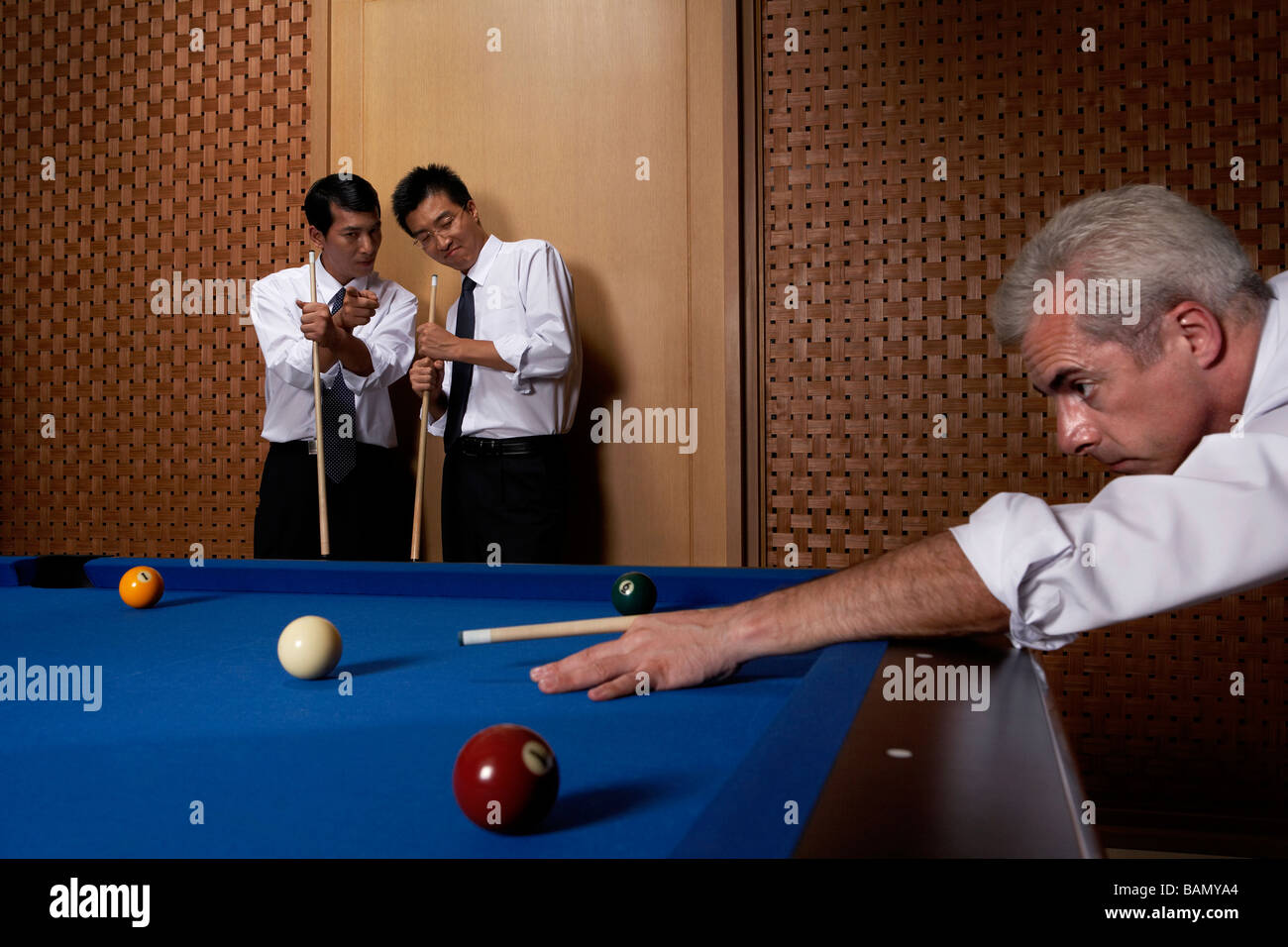 Three professionals play billiards Stock Photo - Alamy