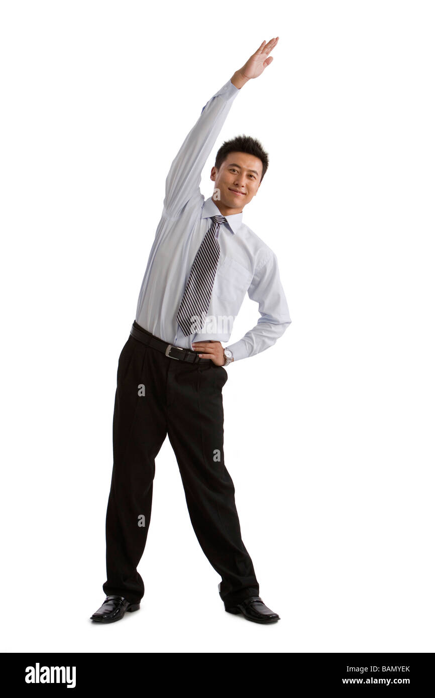 A businessman stretching Stock Photo - Alamy