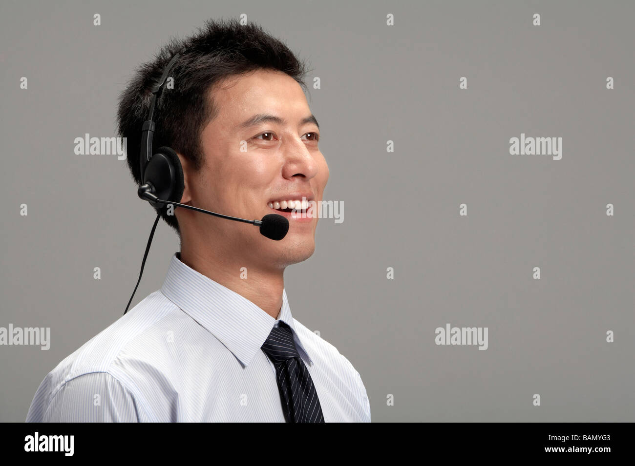 Portrait of a man wearing a headset Stock Photo - Alamy