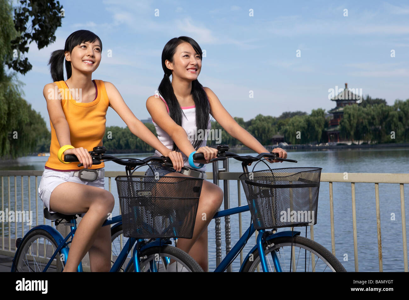 Two young friends ride their bikes Stock Photo - Alamy