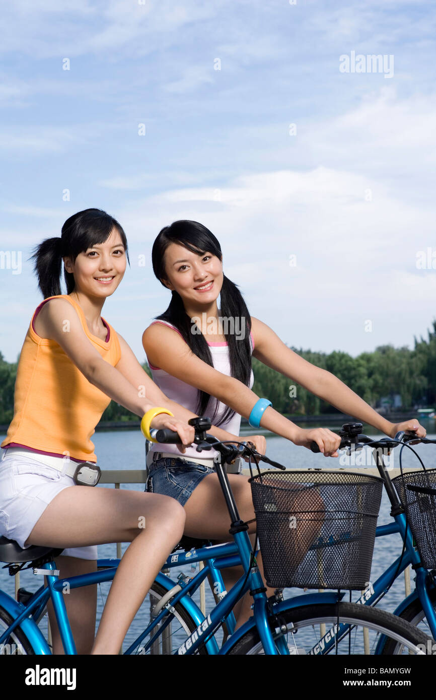 Two young friends ride their bikes Stock Photo - Alamy
