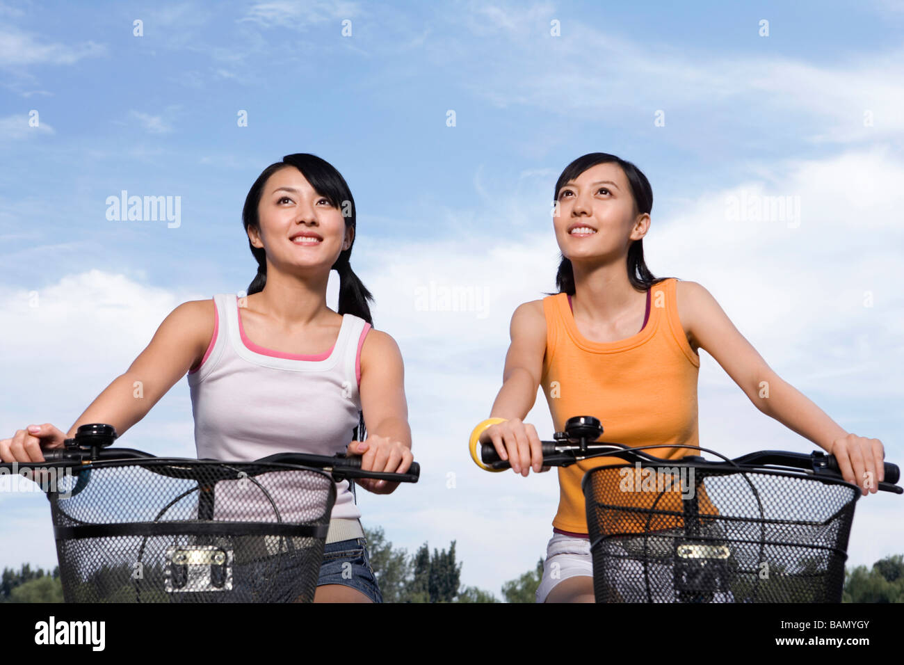 Two young friends ride their bikes Stock Photo - Alamy