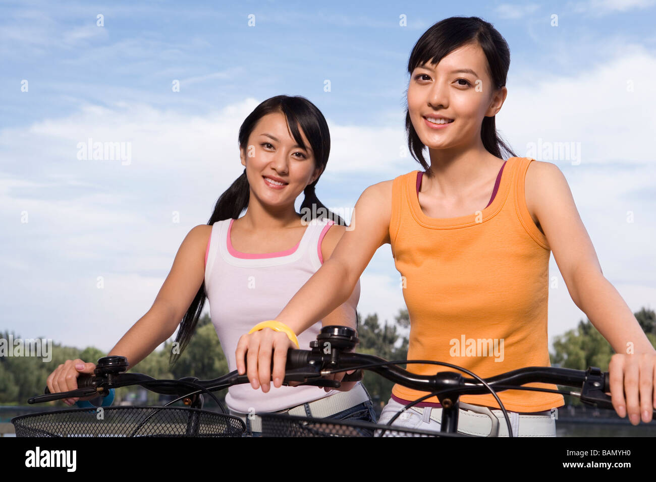 Two young friends ride their bikes Stock Photo - Alamy