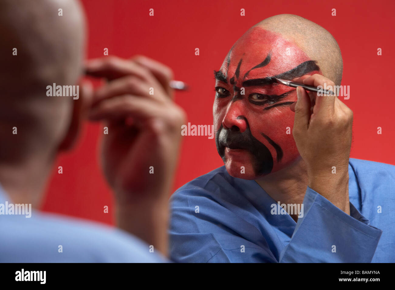 Chinese beijing opera performer applying hi-res stock photography and ...