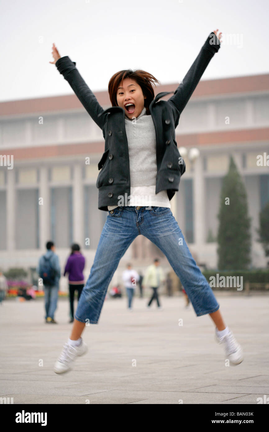 Student jumping excitedly during visit to Tiananmen Square, Beijing ...