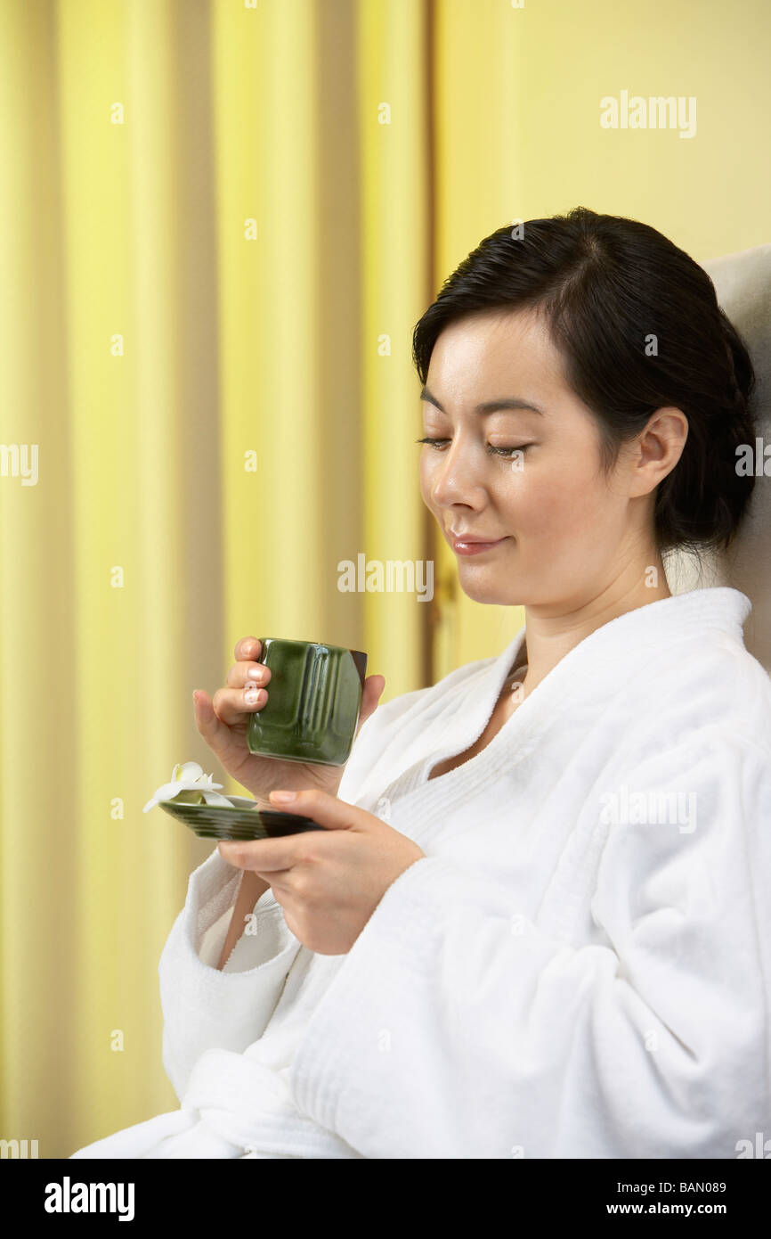 Woman drinking tea at a spa Stock Photo - Alamy