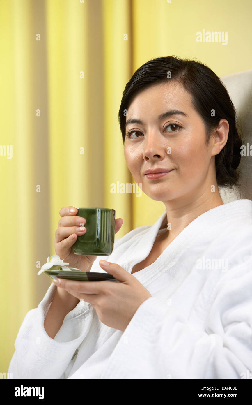 Woman drinking tea at a spa Stock Photo - Alamy