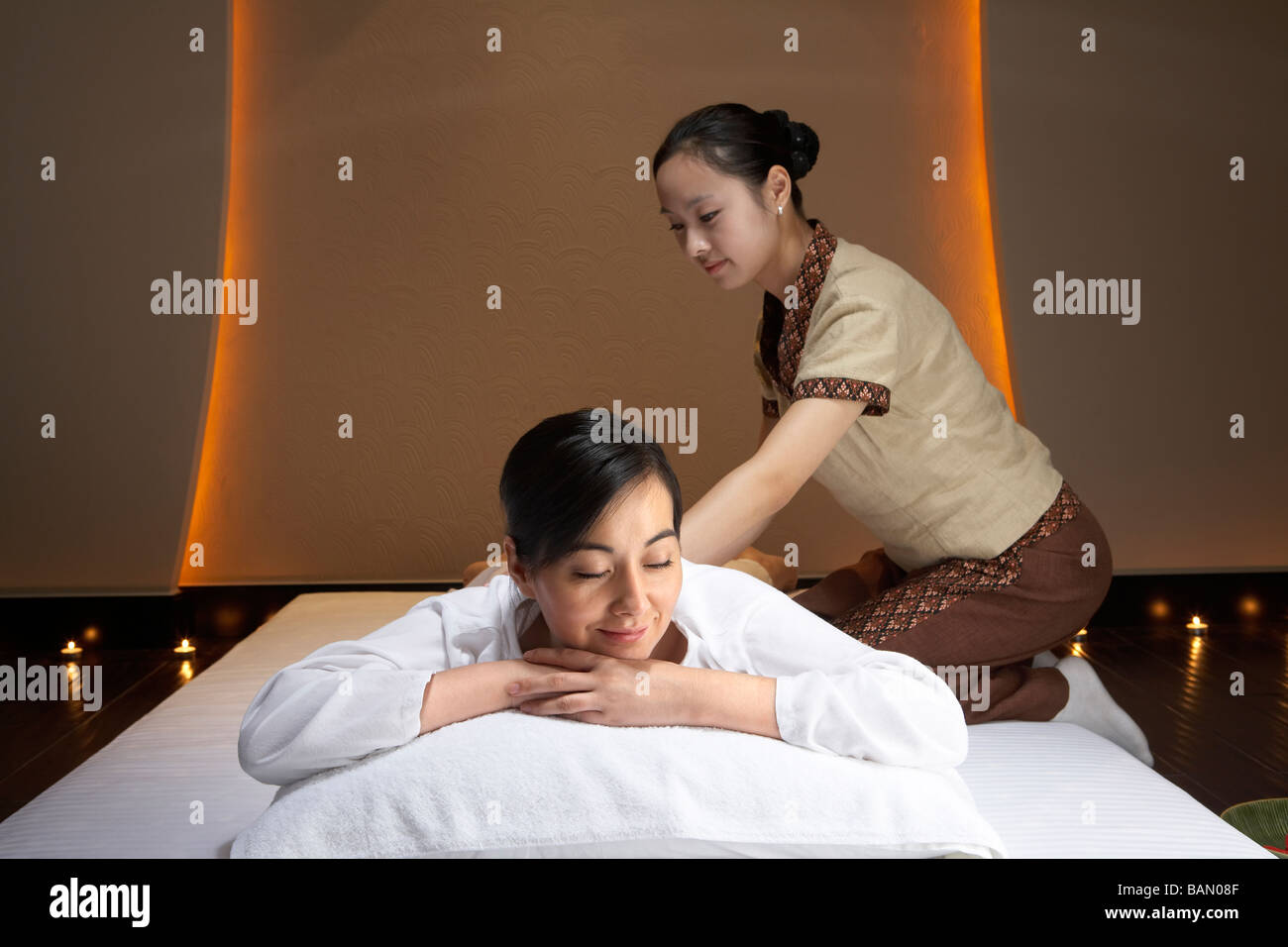 Spa attendant massaging woman Stock Photo - Alamy