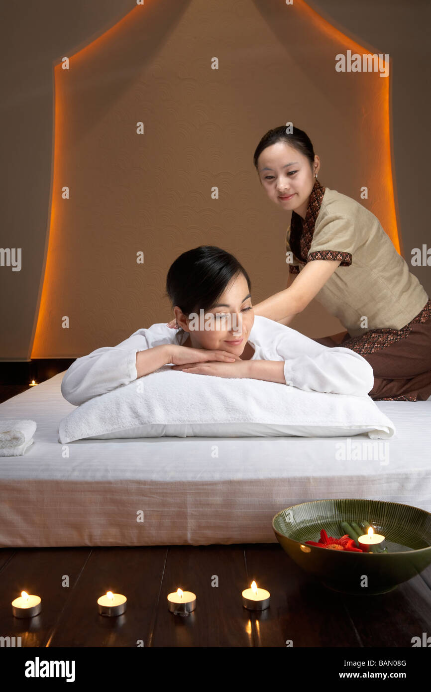 Spa attendant massaging woman Stock Photo - Alamy