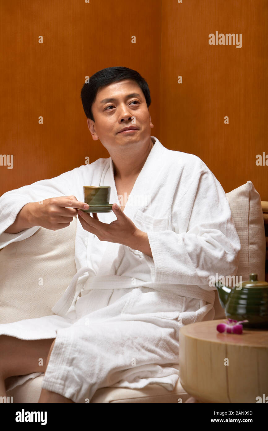 Man drinking tea at a spa Stock Photo - Alamy