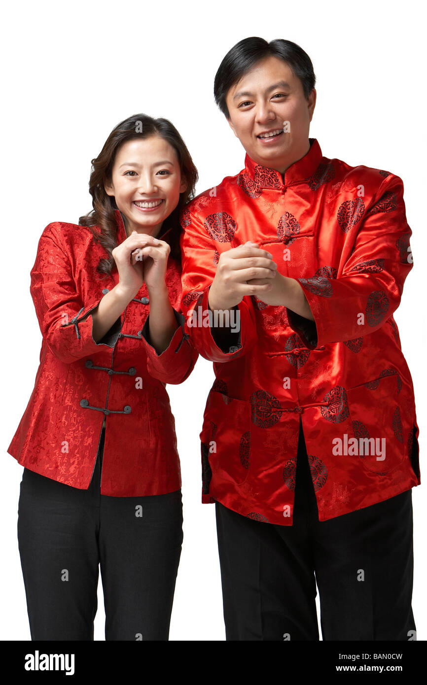 A couple makes a gesture of greeting and good wishes Stock Photo - Alamy