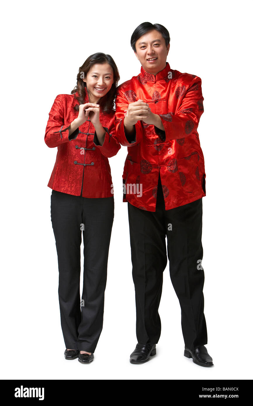 A couple makes a gesture of greeting and good wishes Stock Photo - Alamy