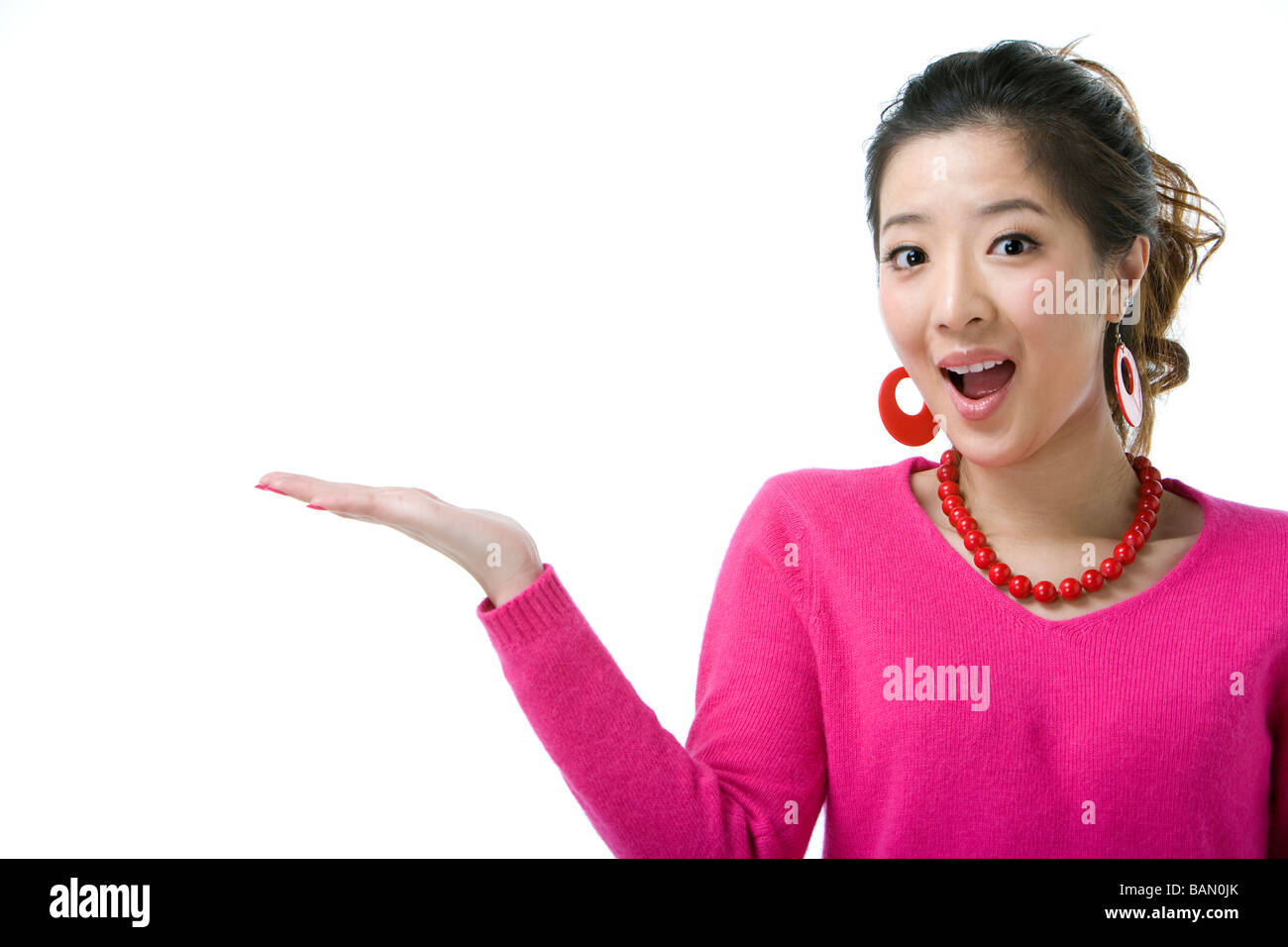 Young woman with her hand up Stock Photo - Alamy