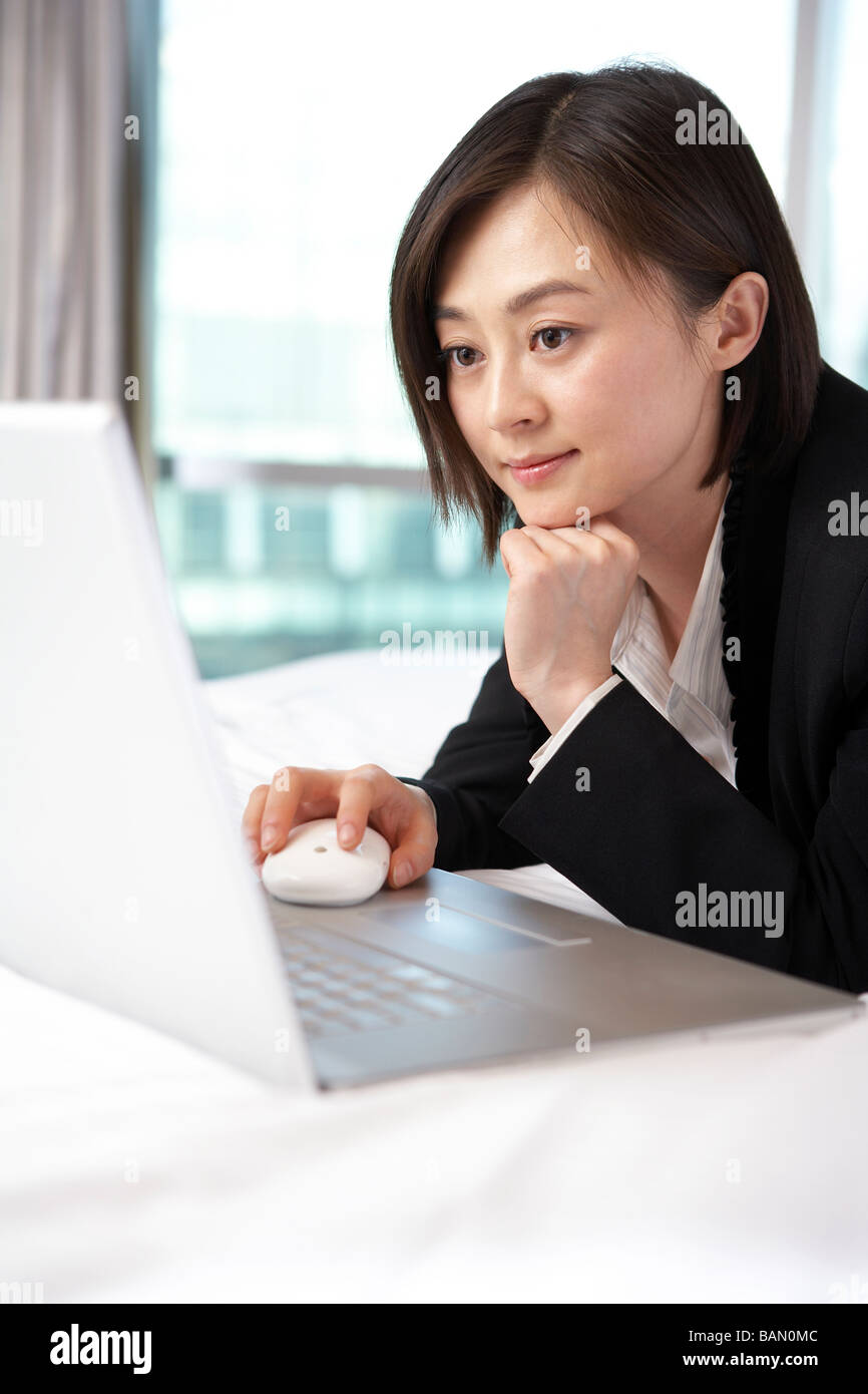 Woman looking at her computer Stock Photo - Alamy