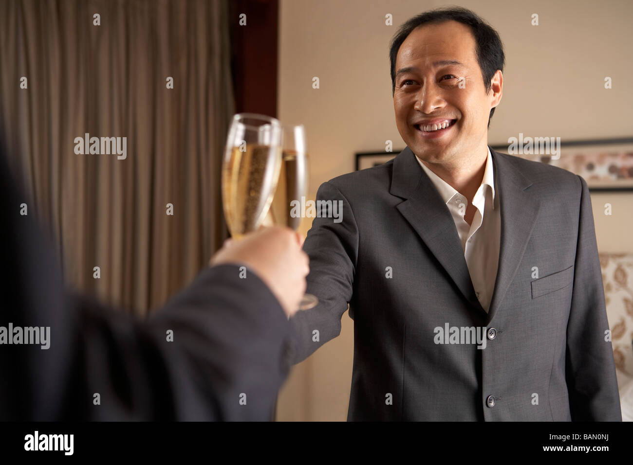 Men toasting with champagne Stock Photo - Alamy