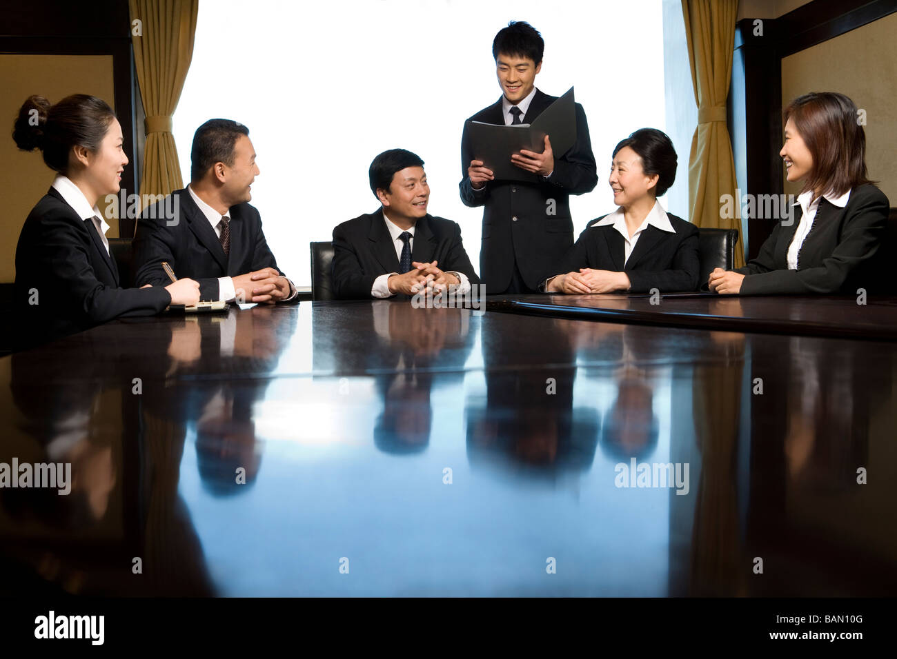 Corporate Team in the Boardroom Stock Photo - Alamy
