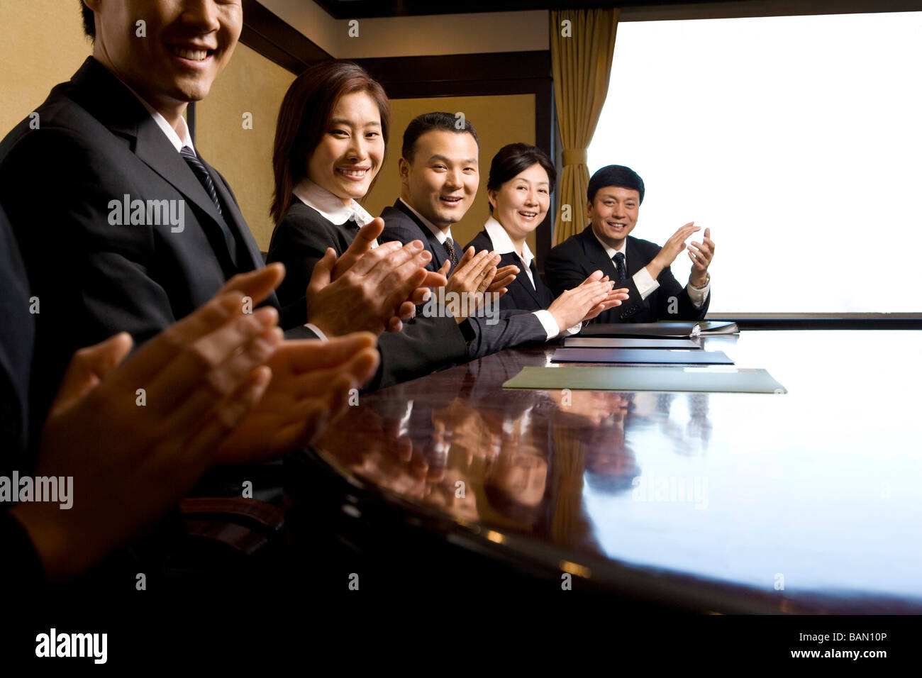 Corporate Team in the Boardroom Stock Photo - Alamy