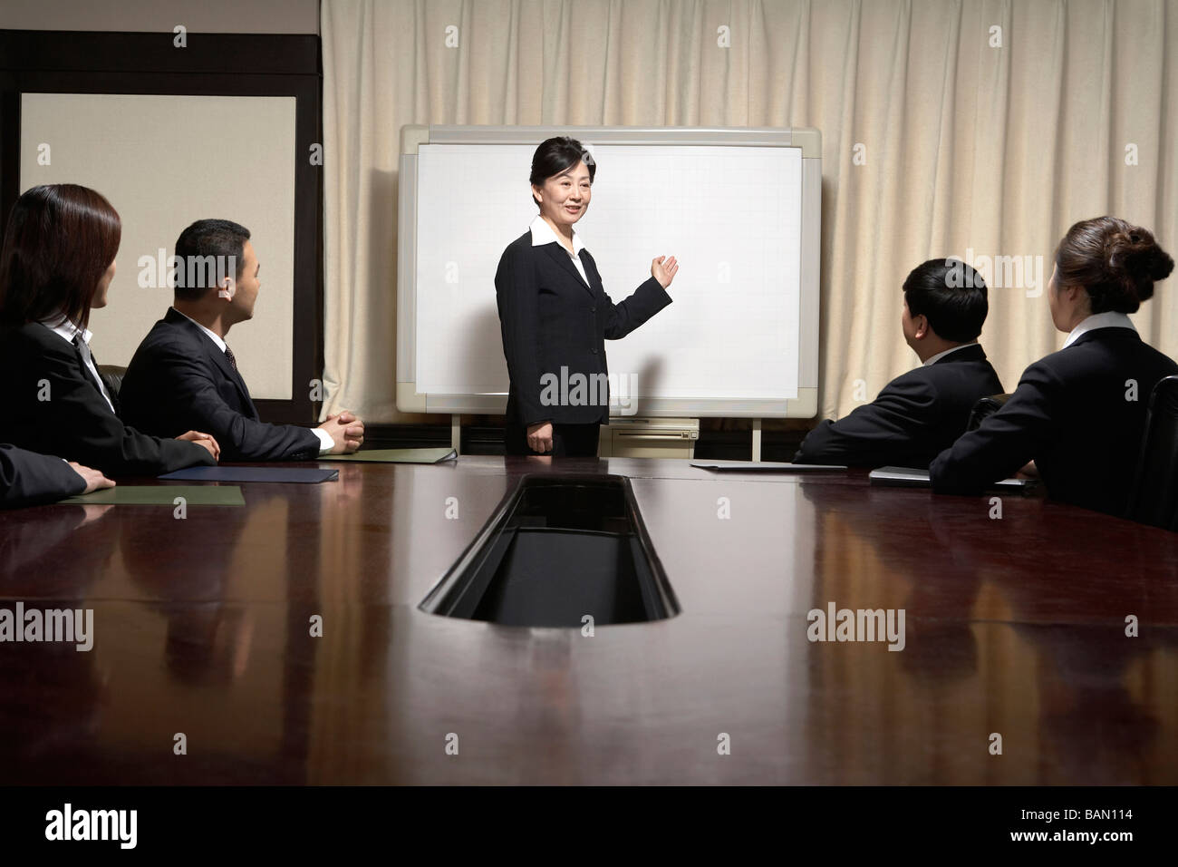 Corporate Team in the Boardroom Stock Photo - Alamy