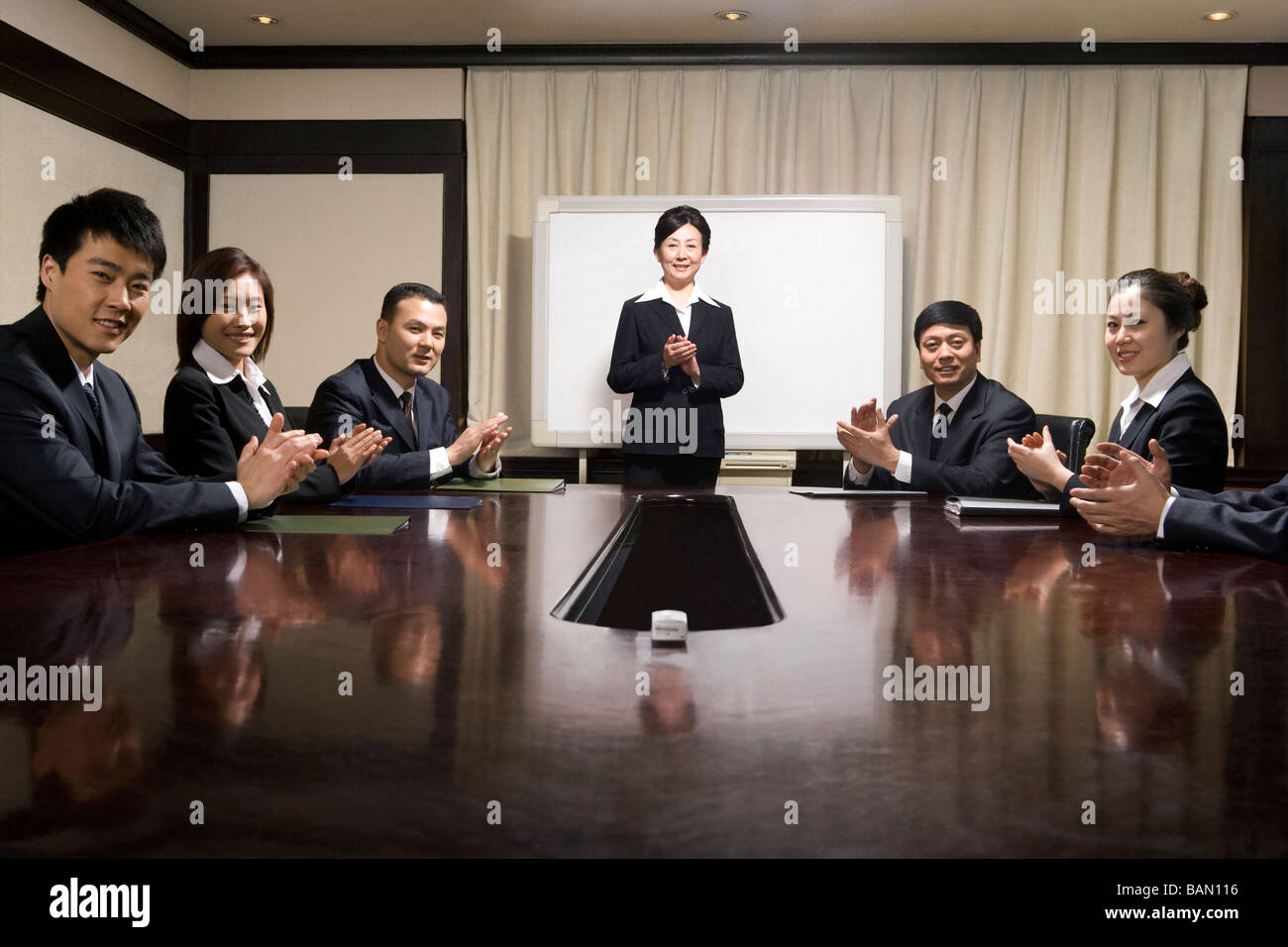 Corporate Team in the Boardroom Stock Photo - Alamy