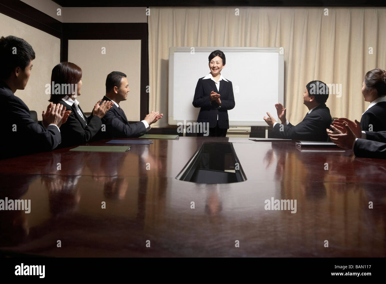 Corporate Team in the Boardroom Stock Photo - Alamy