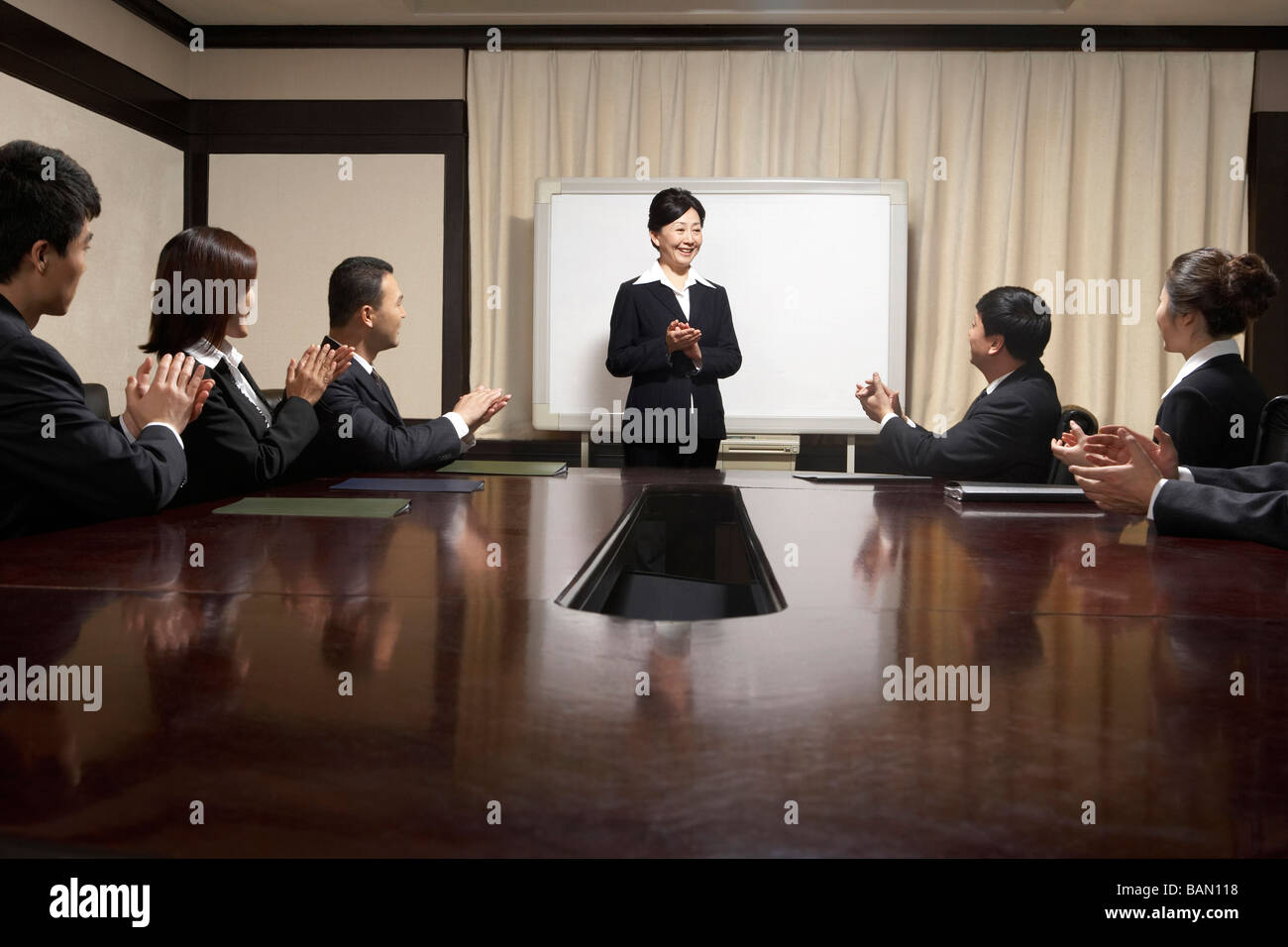 Corporate Team in the Boardroom Stock Photo - Alamy