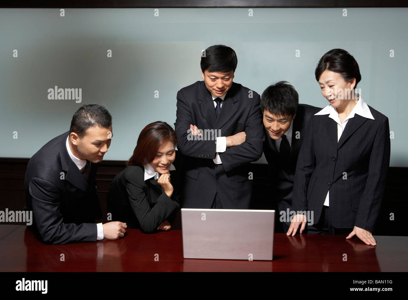 Corporate Team in the Boardroom Stock Photo - Alamy