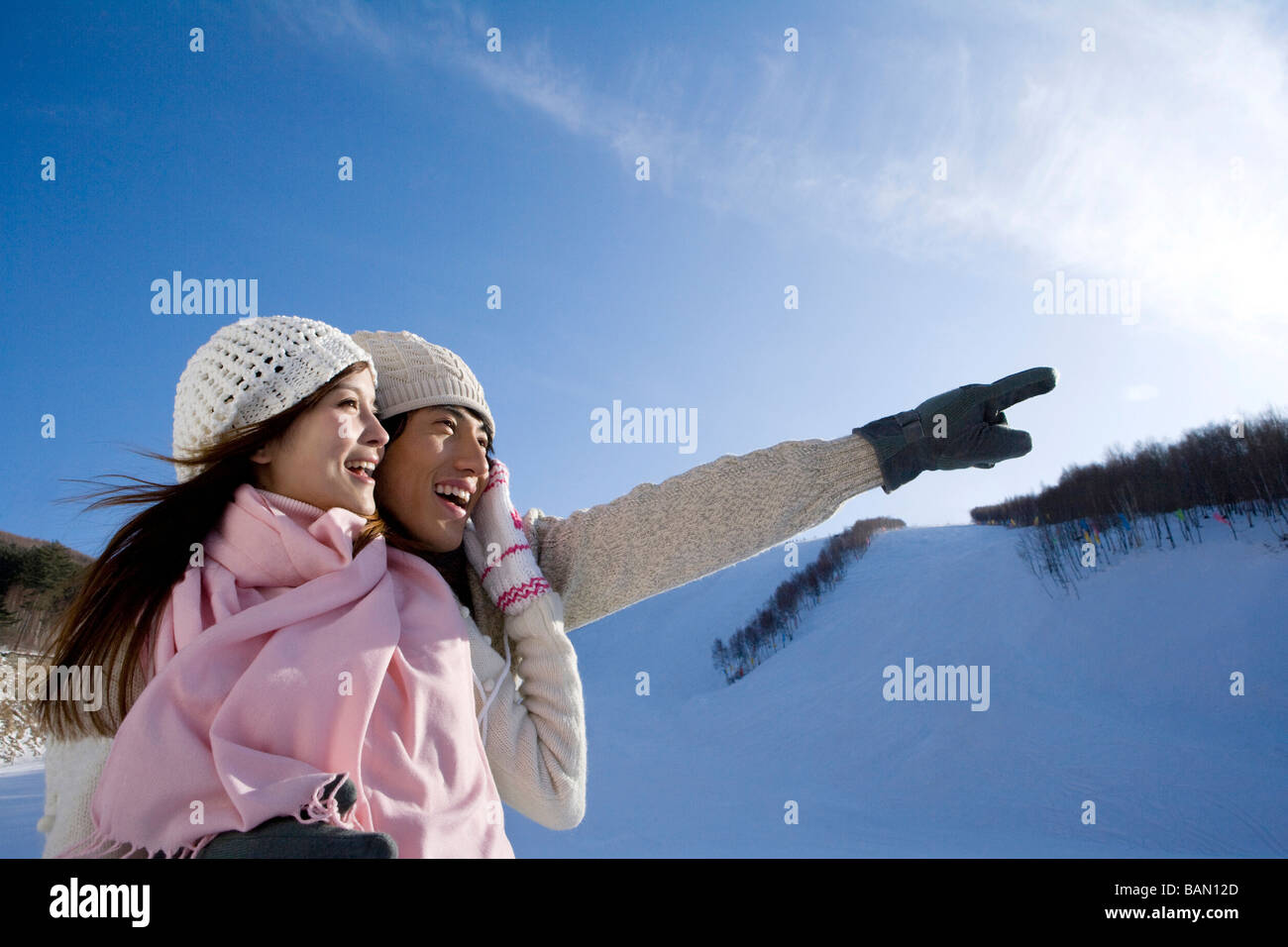Young couple together looking at the view Stock Photo - Alamy