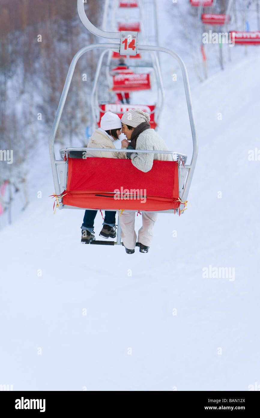 Romantic couple snow rear view hi-res stock photography and images - Alamy