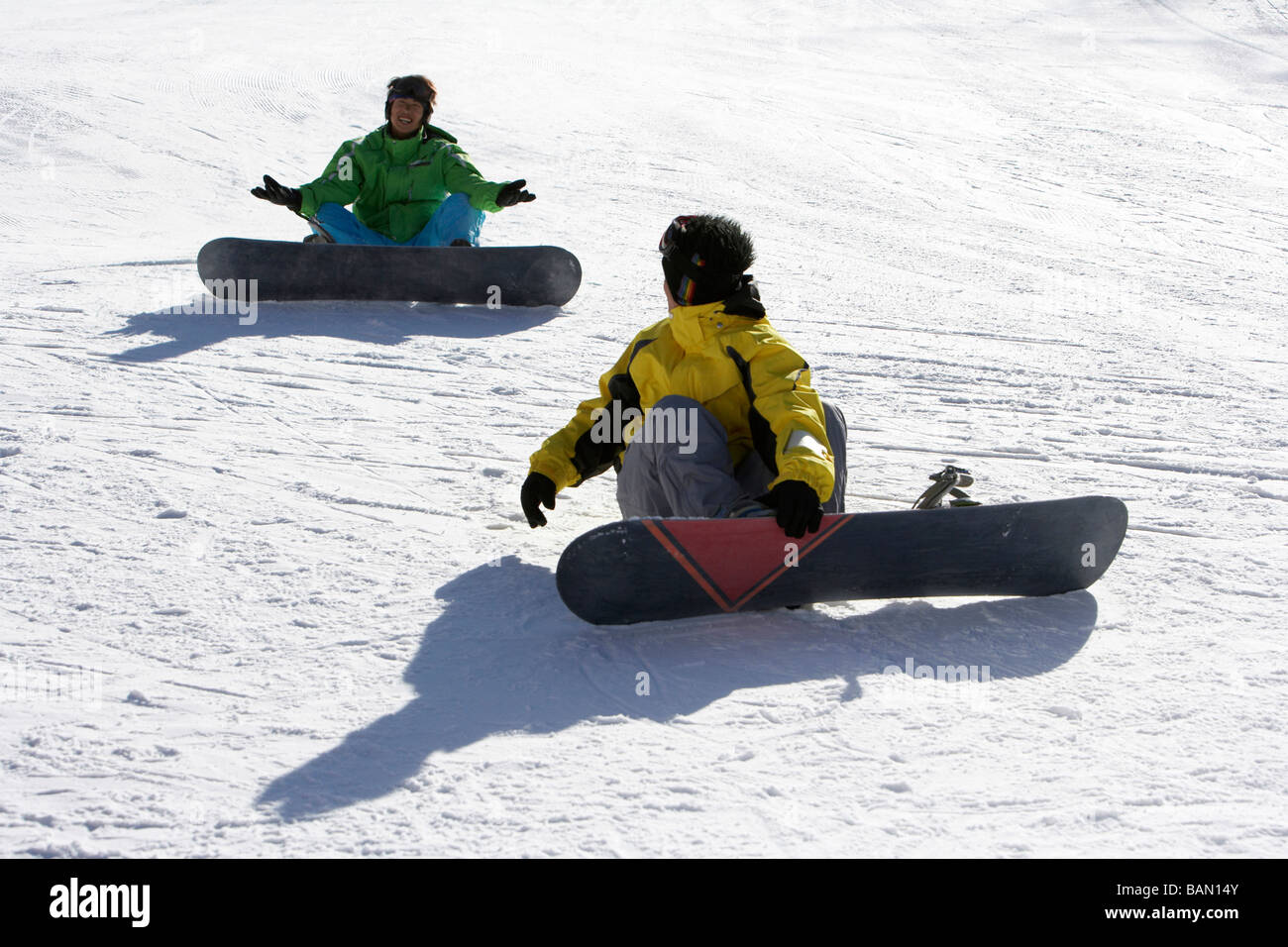 Two young men with their snowboards Stock Photo - Alamy